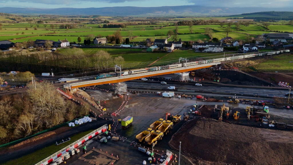 First trains run across new £60 million bridge as West Coast Main Line ...